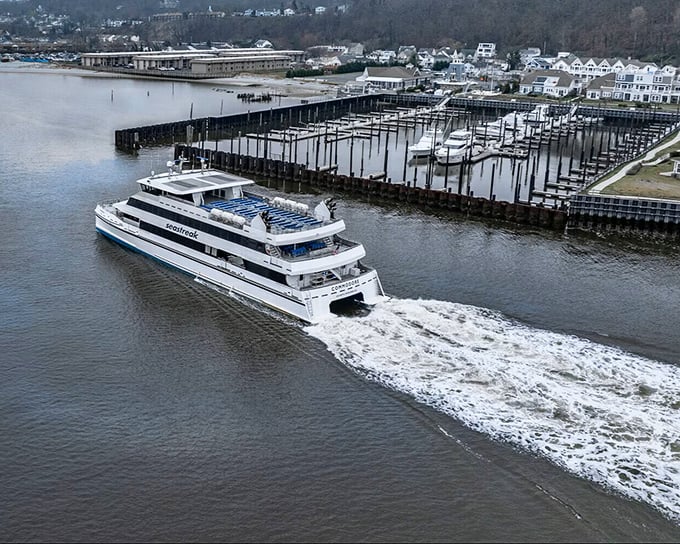 The Seastreak Ferry glides through the Navesink, connecting Red Bank to the wider world while creating impressive wakes that hypnotize onlookers.