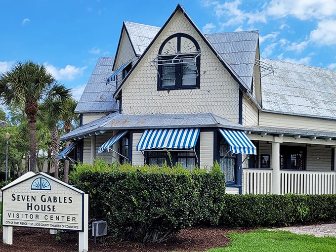 Seven Gables House wears its Victorian charm with blue-and-white striped awnings – architectural eye candy from an era when houses had personality to spare.