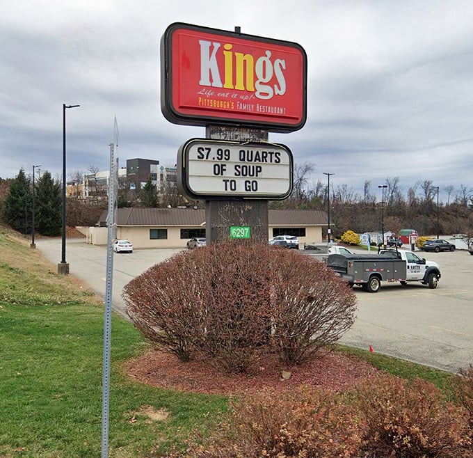 The King's sign stands proud, advertising soup specials that warm both body and soul.