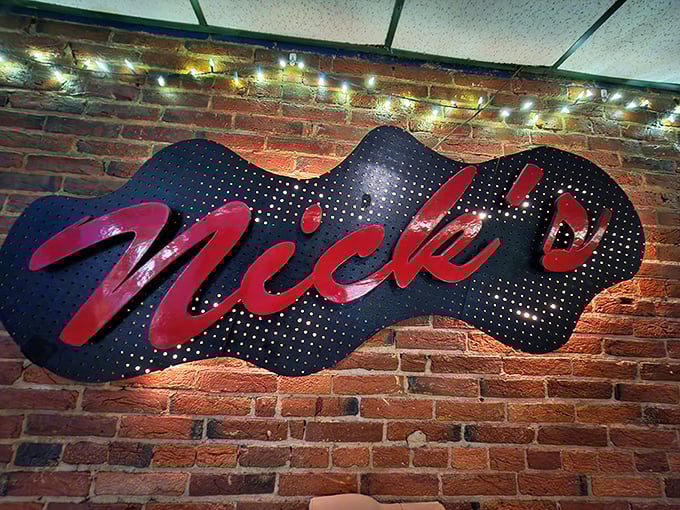 The Nick's sign glows against exposed brick like a beacon for the hungry and those in need of unpretentious culinary satisfaction.