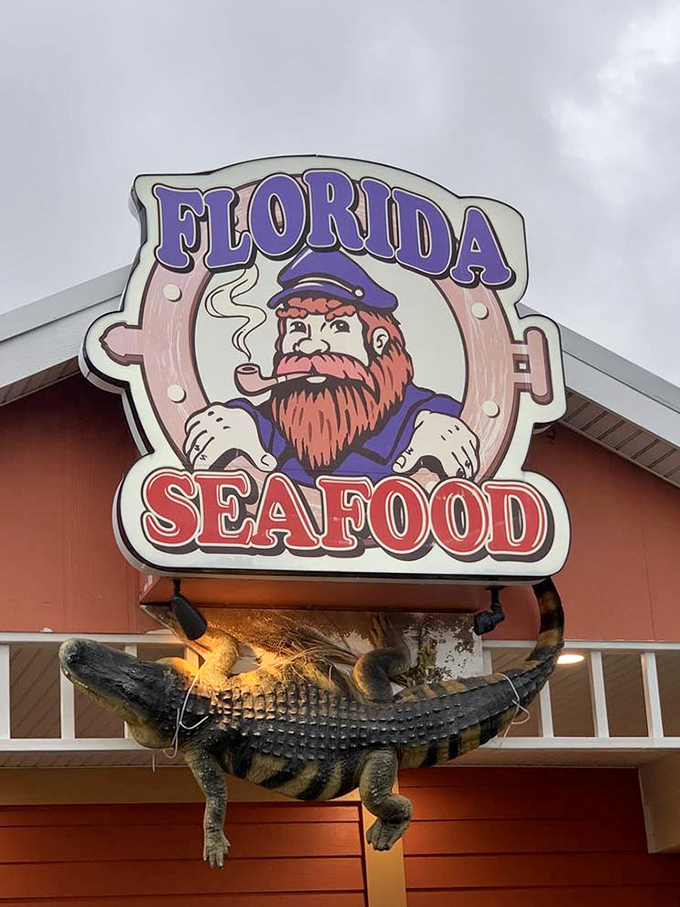 The captain of this culinary ship keeps watch from the sign – his pipe presumably filled with seafood seasoning and Florida sunshine.