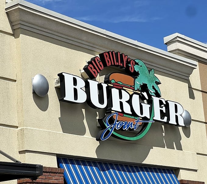The sun casts dramatic shadows behind that iconic sign—nature's way of highlighting your next meal destination.
