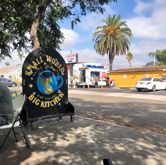Their sidewalk sign promises "Small World, Big Kitchen" – a philosophy that explains why this little café feels bigger than its square footage suggests.