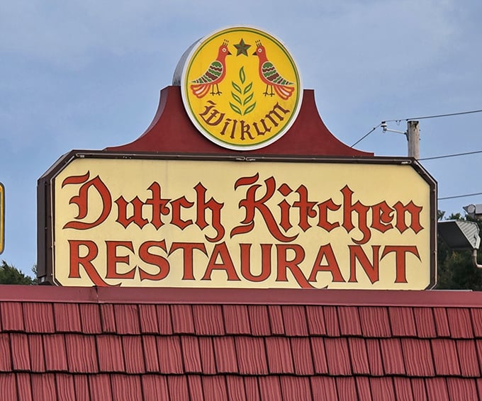 The sign that launched a thousand road trips. Two distressed birds flanking a plant—Pennsylvania Dutch symbolism that promises good food ahead.