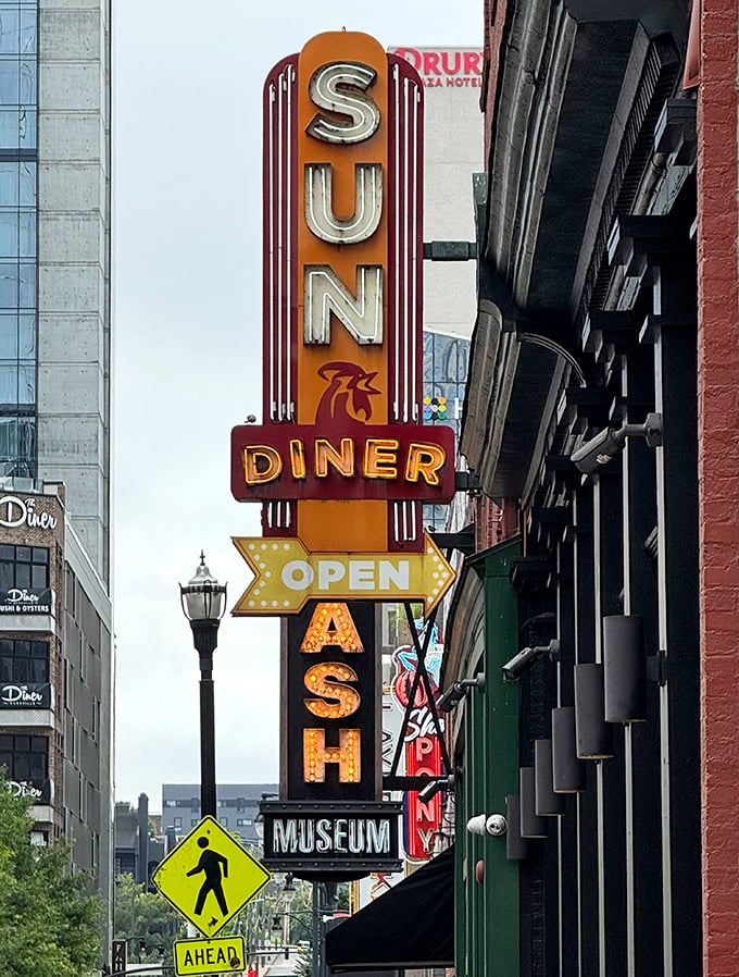 The vintage-style neon sign glows like a beacon for hungry souls wandering Nashville's downtown streets.