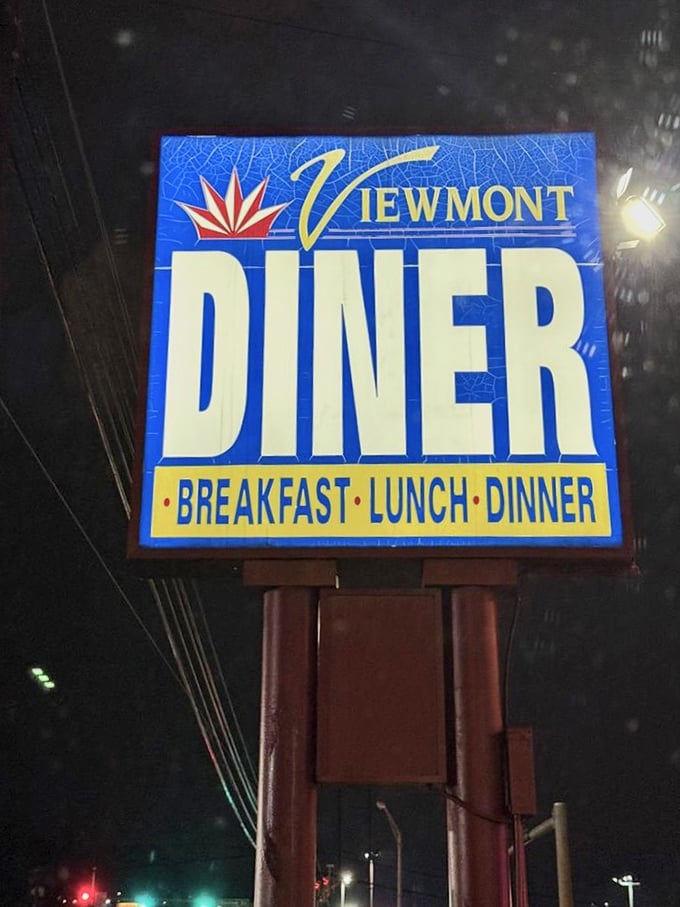 The iconic blue sign shines like a beacon in the night, a North Star for those seeking pancakes at midnight.
