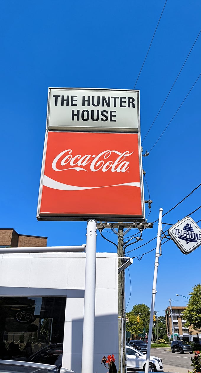 The iconic sign stands tall against Michigan's blue sky, a beacon for burger lovers who know that greatness doesn't need neon lights.