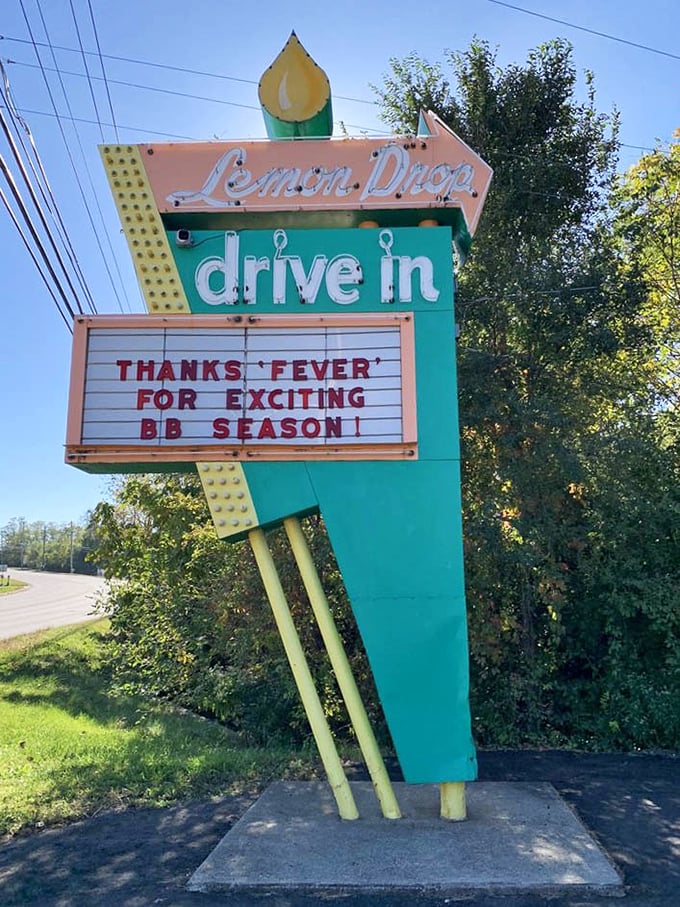 The vintage sign doesn't just advertise a restaurant—it's a neon-lit beacon of hope for travelers seeking authentic food in a world of cookie-cutter chains.