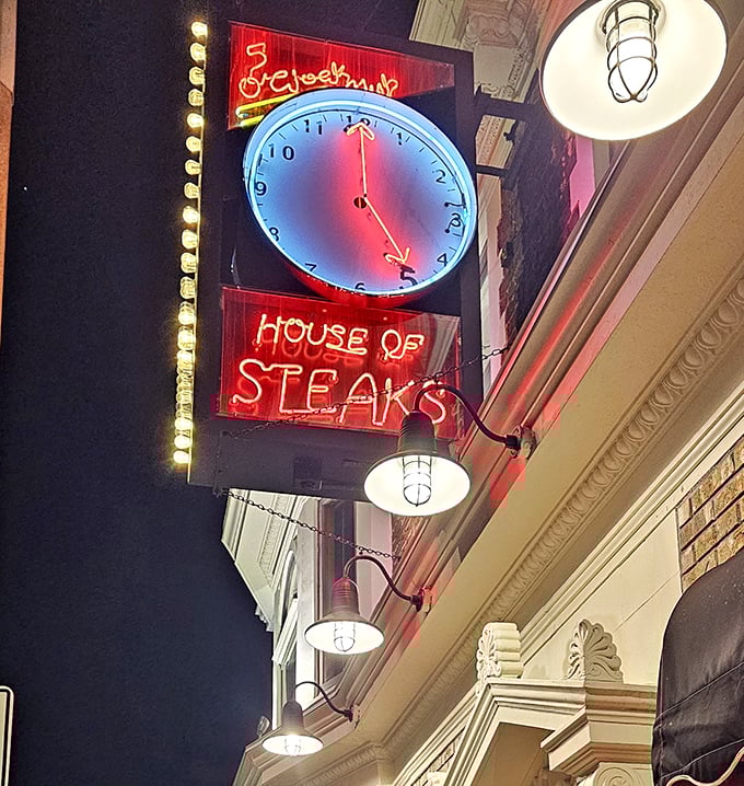 The iconic neon clock sign glows against the night sky, announcing to Milwaukee that it's always the right time for a perfect steak.