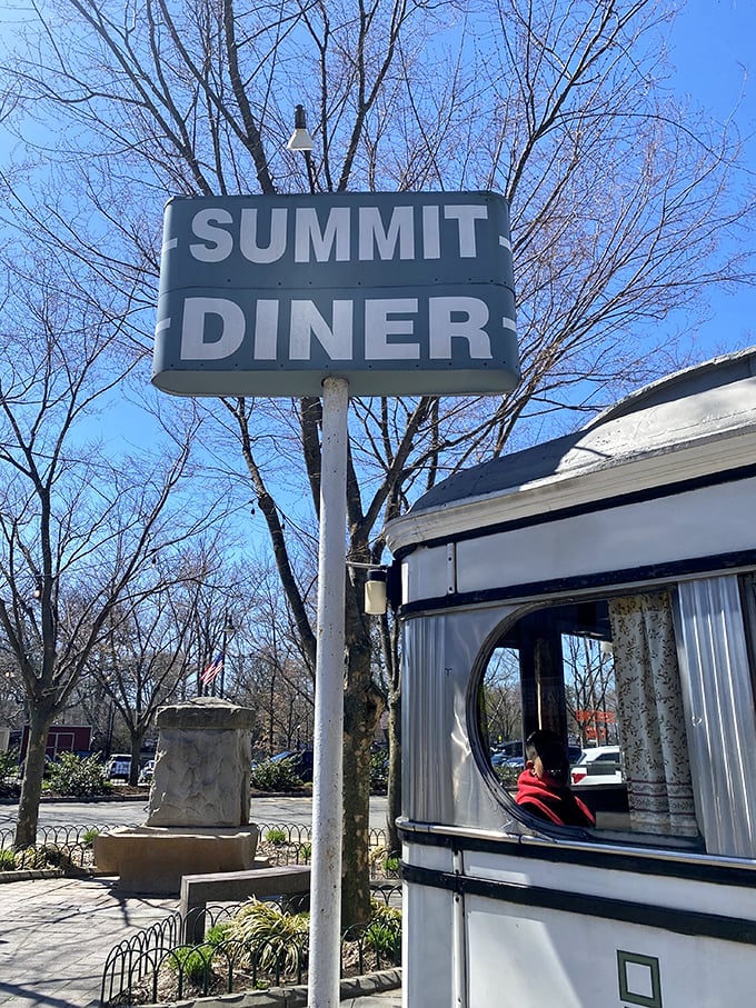 The Summit Diner sign against a blue sky—a beacon of hope for the hungry and a landmark that's guided generations to great meals.