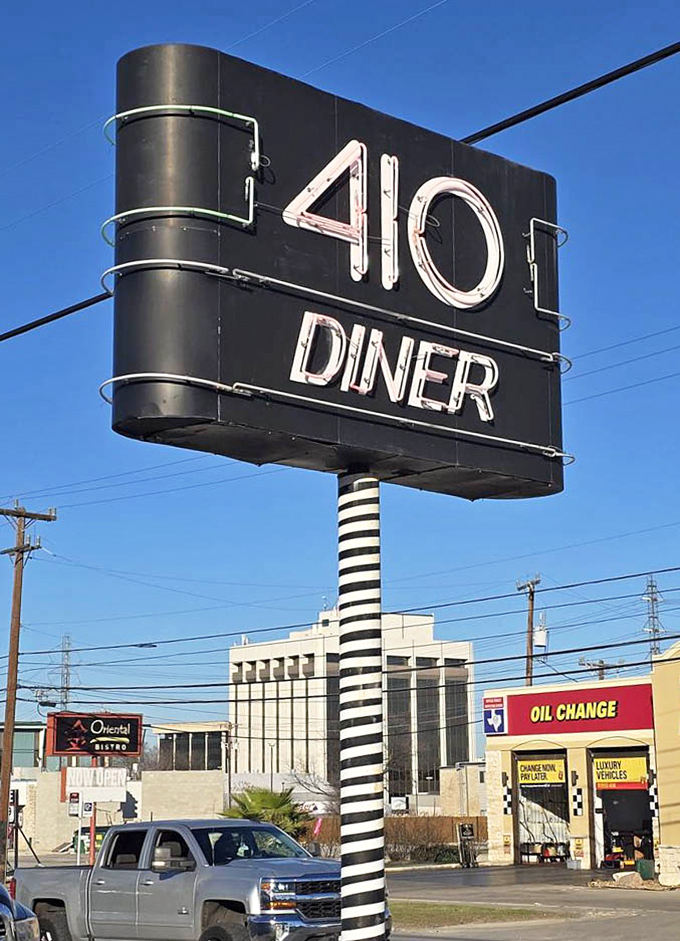 That iconic sign stands as a beacon for hungry travelers and locals alike – no fancy fonts or pretension, just the promise of honest food.