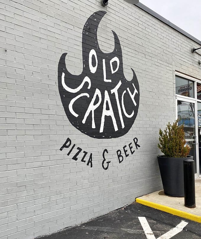 The iconic flame logo emblazoned on the building's exterior—a beacon for hungry souls seeking pizza salvation in Dayton's urban landscape.
