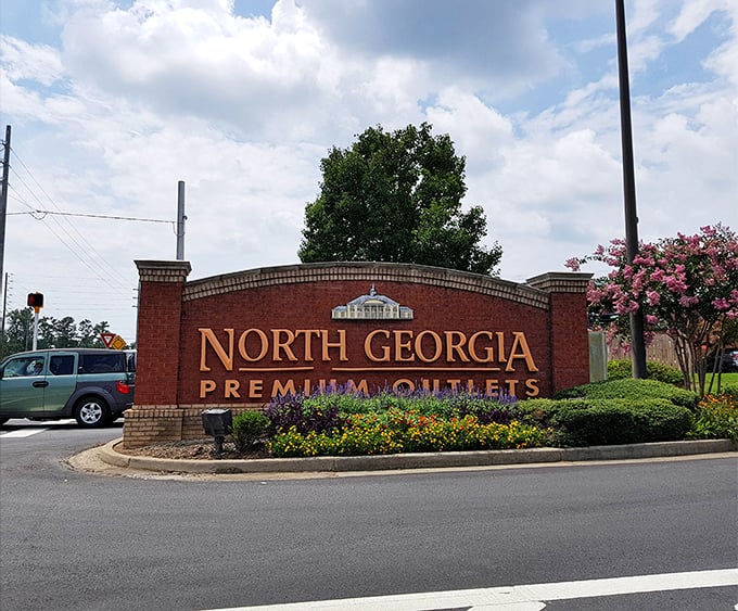 The grand entrance sign welcomes shoppers with the promise of retail therapy that's more effective than any prescription medication – and potentially more expensive.