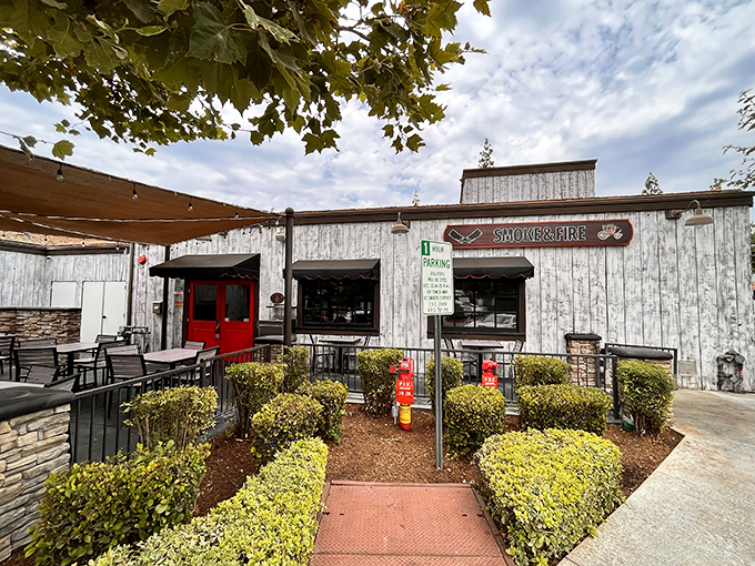 Smoke & Fire's rustic exterior hints at the primal, wood-fired delights waiting inside—where barbecue dreams come true.