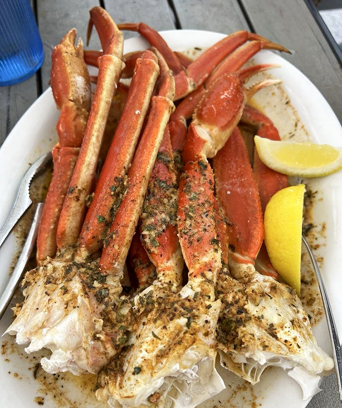 Snow crab legs arranged like nature's perfect eating utensils—just crack, dip in that melted butter, and prepare for sweet oceanic bliss.