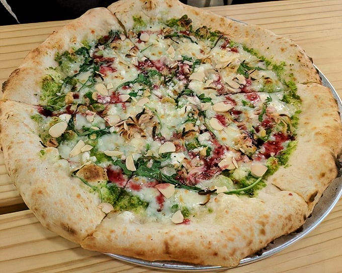 Green meets white meets red in this pizza masterpiece—a fresh take on tradition that makes you wonder why you ever settled for delivery.