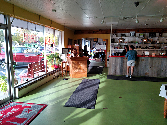 The entrance area—where hope begins and diet plans go to die. That green floor guides you to greatness.