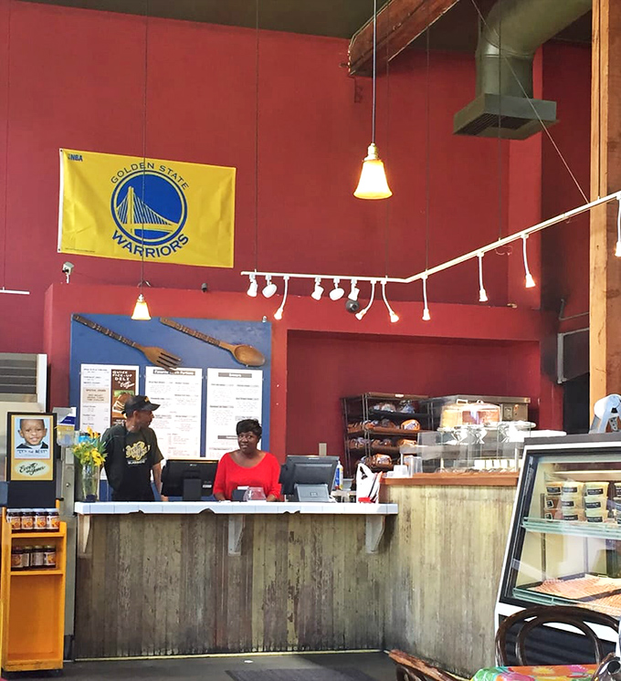 Behind every great barbecue joint is a team that knows their smoke and fire. The Warriors flag says it all—this place is pure Oakland.