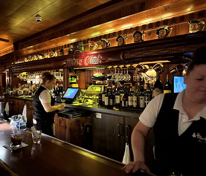 Behind the bar, skilled hands work with practiced efficiency – these aren't just servers, they're custodians of a dining tradition.