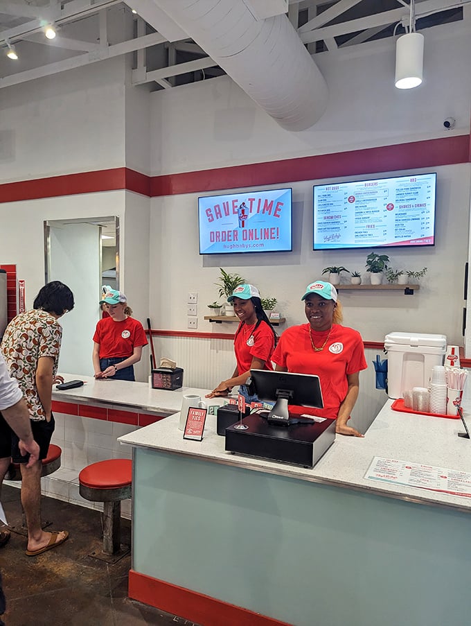 The staff in their bright red shirts—food ambassadors ready to guide you through your journey from hungry to happy in record time.