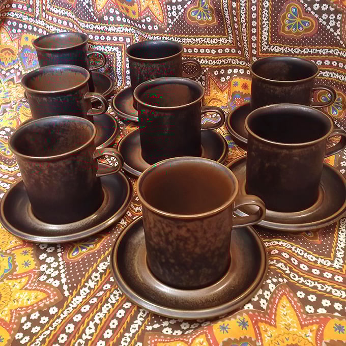 These earthy stoneware cups aren't just vessels for coffee—they're time portals to conversations had around kitchen tables decades ago.