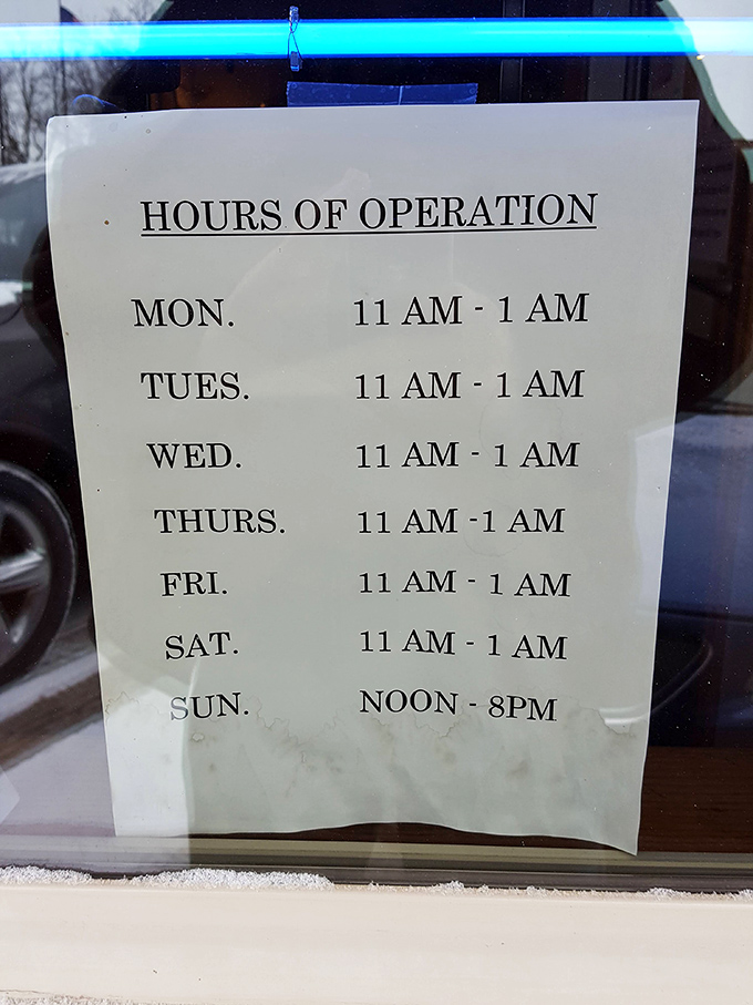 Hours posted clearly—because knowing when you can get your French onion soup fix is essential information for survival.