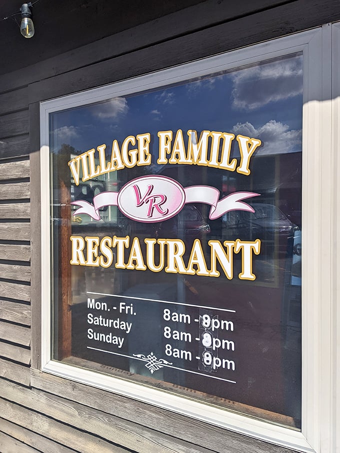 The window sign promises hours generous enough to accommodate both early birds and night owls—all seeking the same comfort food salvation.