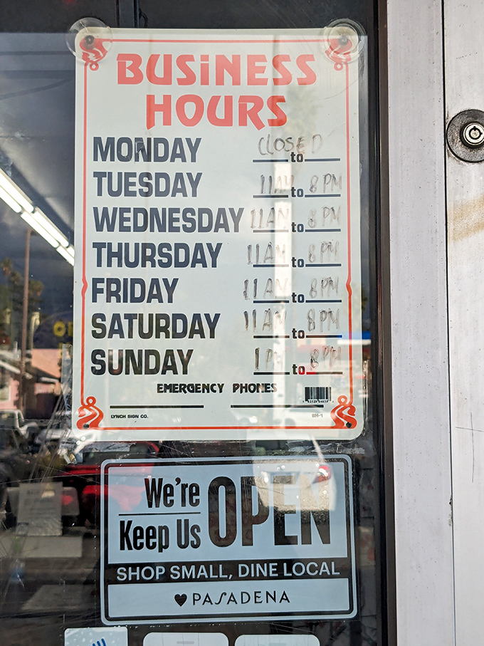 Hours posted like a promise. Closed Mondays—even culinary wizards need a day off to recharge their spice-wielding powers.