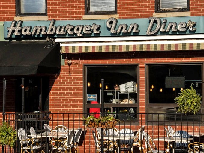 That vintage signage isn't retro by design—it's authentic by survival. The striped awning adds a touch of Parisian café to this all-American institution.