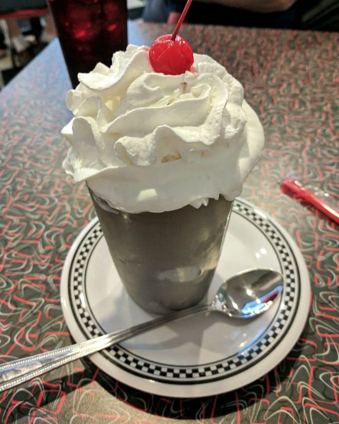 That's not just whipped cream and a cherry—it's the exclamation point at the end of a milkshake sentence that reads "This is how it's supposed to taste!"