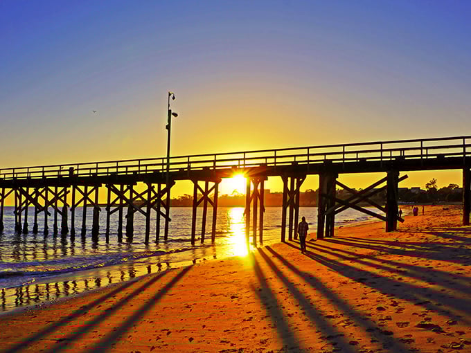 As the sun dips through Goleta's pier, it transforms ordinary wood into a golden gateway, proving nature remains California's most talented lighting designer.