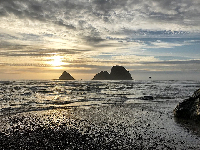 The sun bidding farewell to Three Arch Rocks. This daily light show never gets old—nature's version of must-see TV.