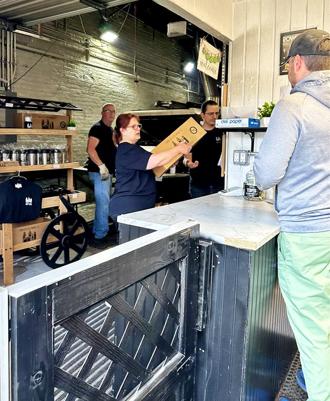 The pretzel handoff—a sacred transaction where dough transformed by fire and skill passes from artisan to appreciative customer. 