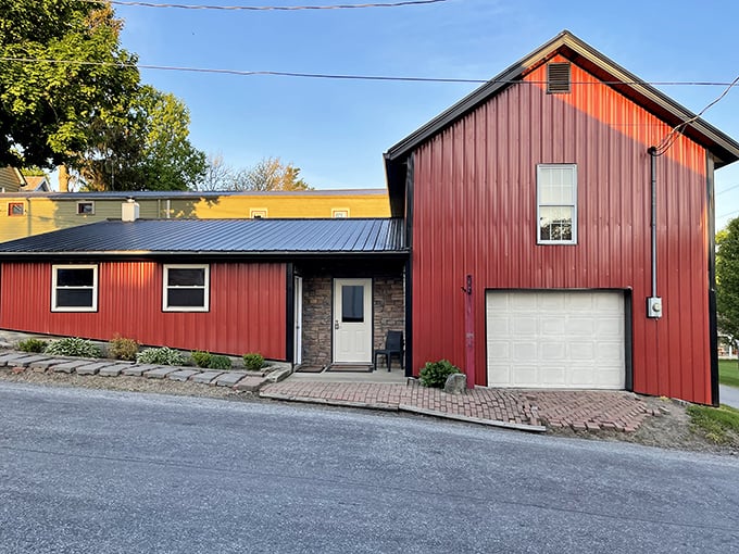 This red barn wasn't designed by an architect trying to capture "rustic chic"—it was built by people who needed somewhere practical to store things. 