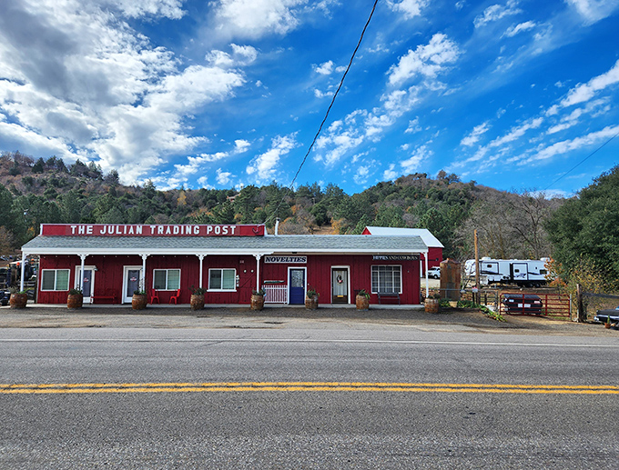 The Julian Trading Post's red facade isn't just a building—it's a portal to a time when "shopping local" wasn't a trend but a necessity.