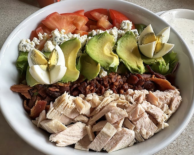 This Cobb salad demonstrates the art of thoughtful arrangement. Avocado, egg, bacon, and turkey in perfect harmony—like the Beatles of lunch.
