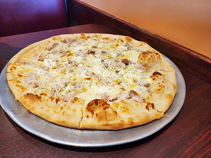 White pizza perfection—where creamy cheese meets savory toppings in a beautiful relationship that needs no red sauce third wheel.