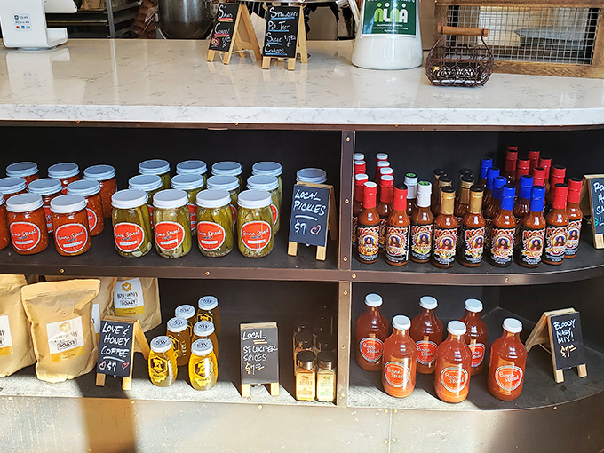 House-made sauces and pickles line the shelves like trophies of flavor achievement. Each bottle contains liquid gold for your chicken adventure.