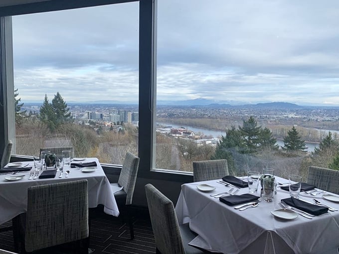 The view isn't just pretty—it's Portland's entire skyline serving as your personal dinner entertainment, no reservations required for this show.