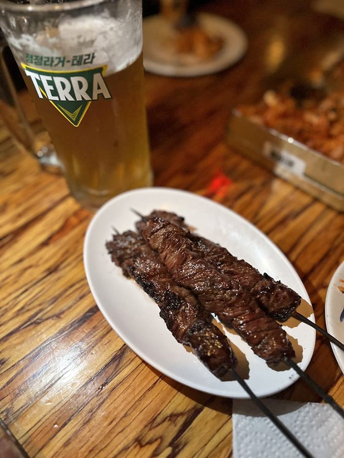 These beef skewers aren't just cooked – they're transformed. The char marks are like flavor autographs from the grill master.