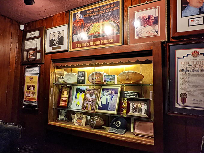 The wall of fame tells stories of celebrity visits and local legends, a scrapbook of memories preserved between bites of perfectly cooked steak.