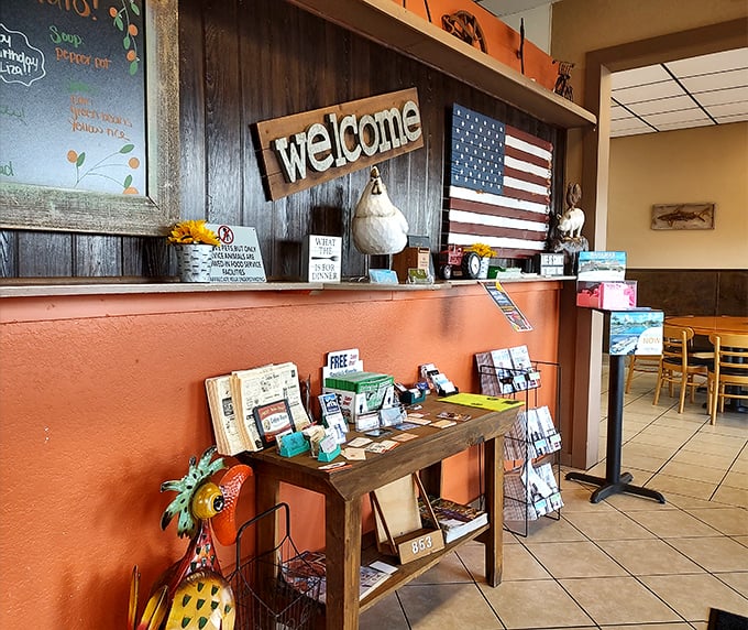 The welcome area's Americana decor sets the tone—this is a place where community notices share space with patriotic pride.