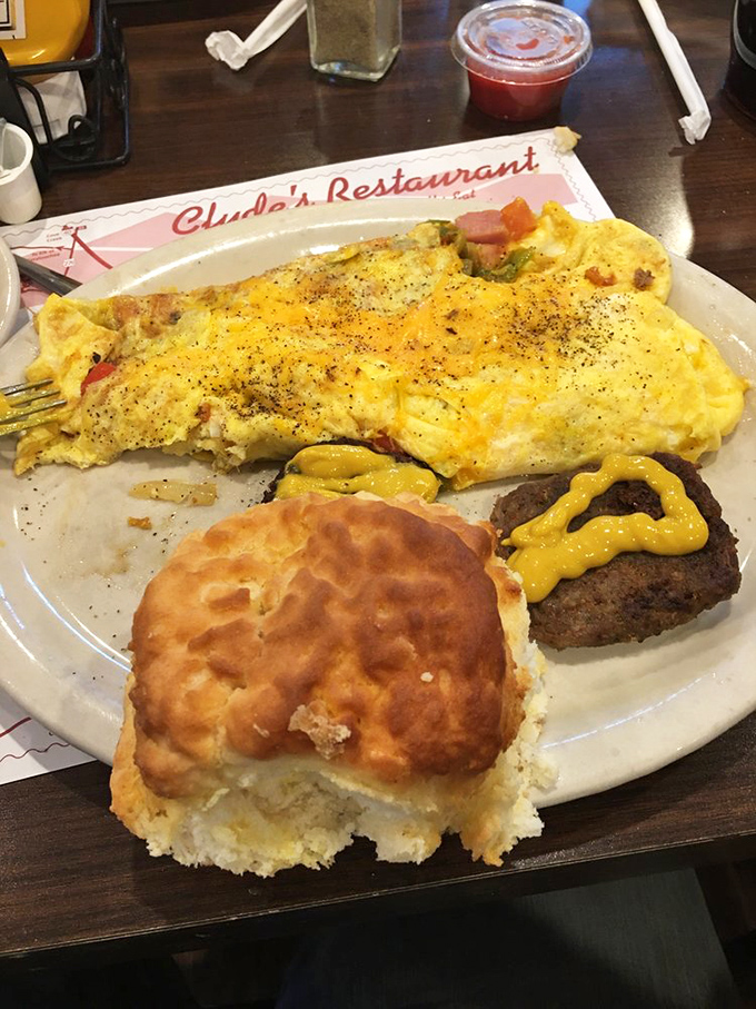 This Western omelet and burger combo proves breakfast and lunch can coexist peacefully on the same plate. That biscuit is the diplomat. 
