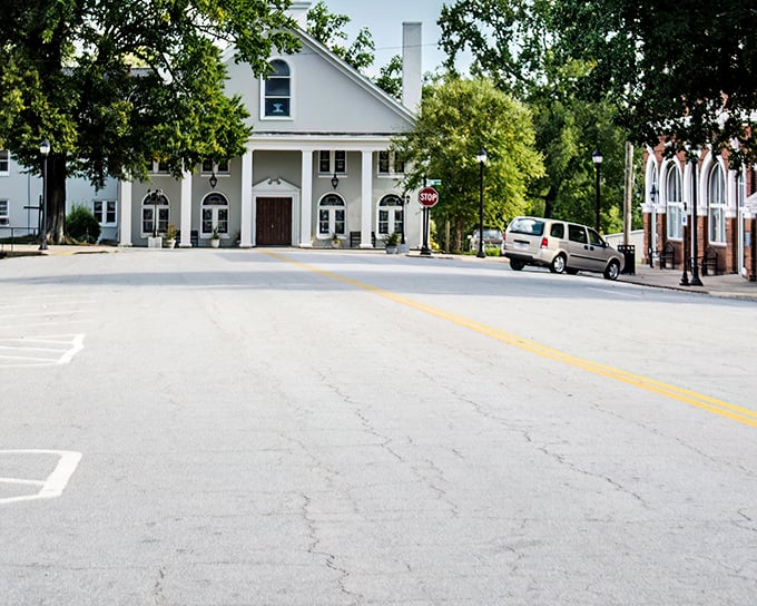 The white church building stands as a community cornerstone, its classic design a familiar sight in small Southern towns.