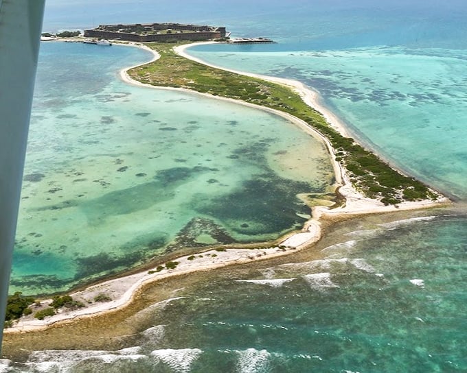 Mother Nature's masterpiece viewed from above: The distinctive horseshoe shape of Garden Key cradles Fort Jefferson like a precious artifact in a display case.