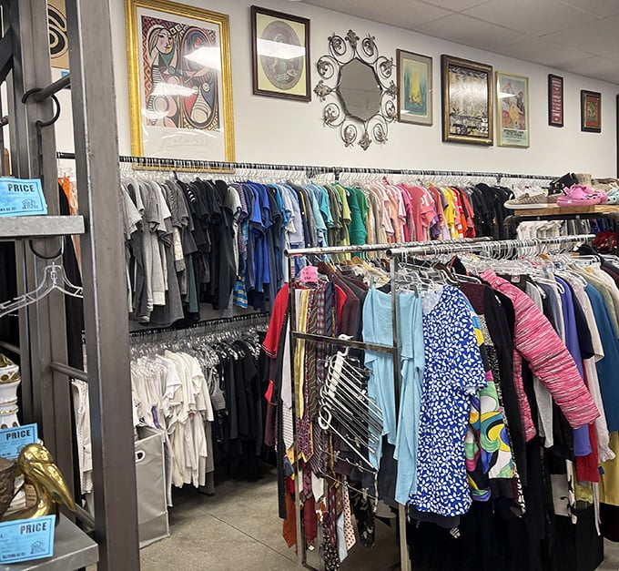 The clothing section—where vintage Picasso prints hang near tropical patterns, proving fashion never truly dies, it just takes a sabbatical.