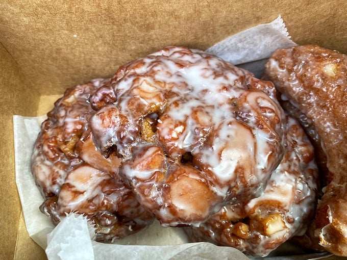 Apple fritters with a glaze so perfect it looks like it was applied by Renaissance artists – sweet, sticky evidence that simplicity done right is culinary genius.
