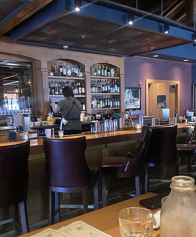 The well-stocked bar isn't just serving drinks—it's dispensing liquid courage to try that extra-spicy étouffée.