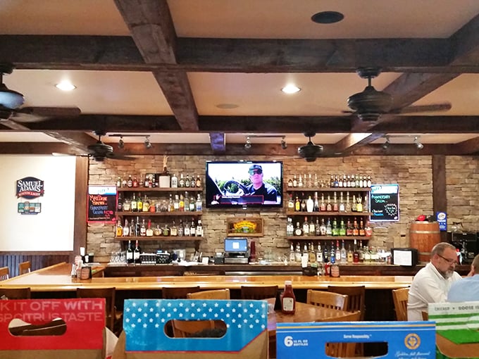 The stone-accented bar area combines rustic charm with modern convenience for the perfect gathering spot.