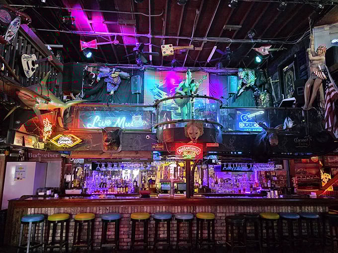 The bar at Lou's Blues isn't just serving drinks – it's serving stories, music, and the kind of neon-lit atmosphere that makes memories.